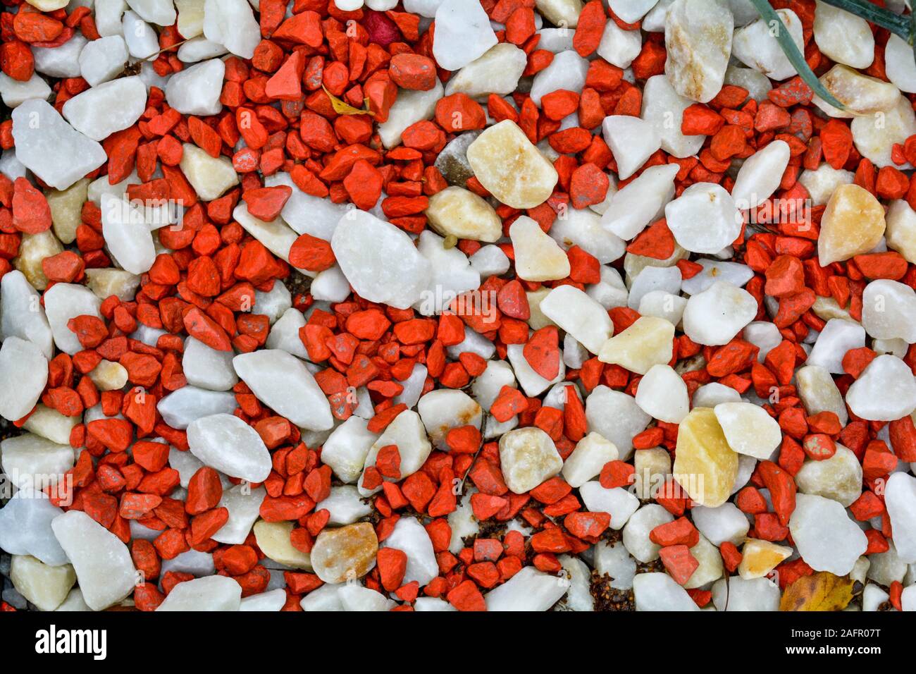 White and red marble fine gravel. Simple stone background with white ...