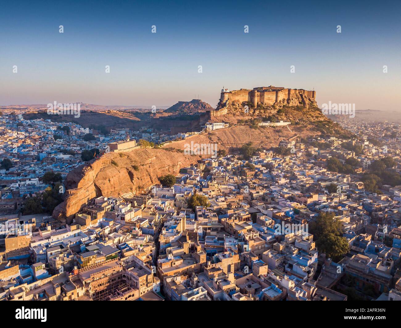 Aerial view of Mehrangarh Fort at sunset sits above the 'Blue City ...
