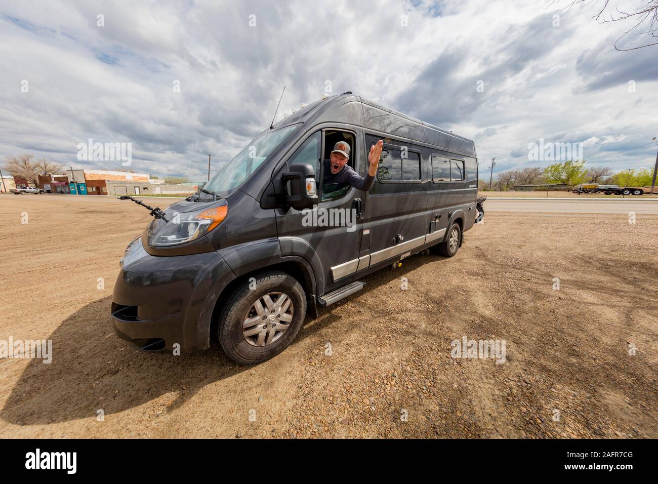 MAY 21 2019, USA - Bill Terry behind wheel of RV waves on Lewis and ...