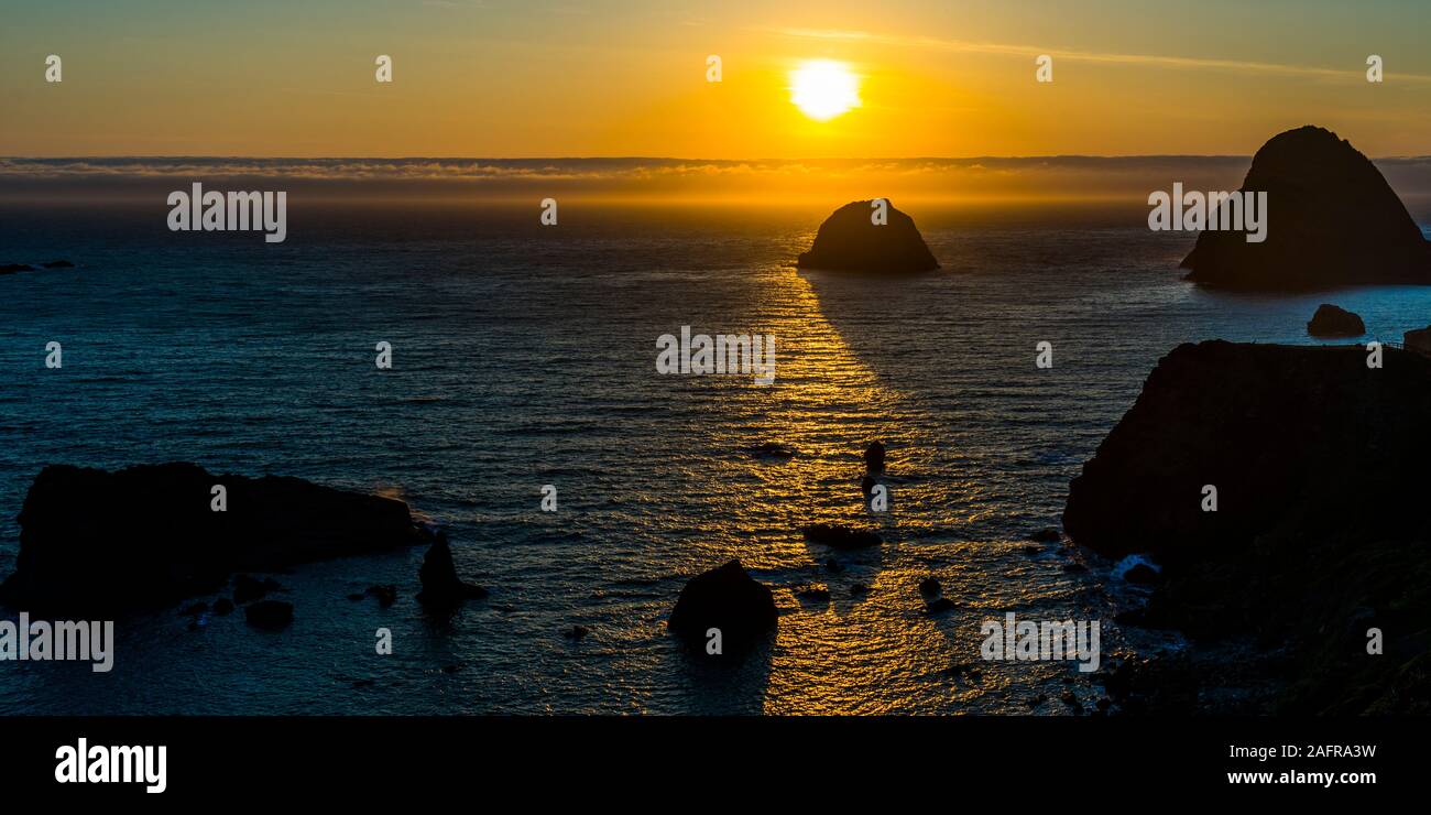 MAY 30, 2019, OREGON COASTLINE, USA - Sunset of sea stacks of rocks ...