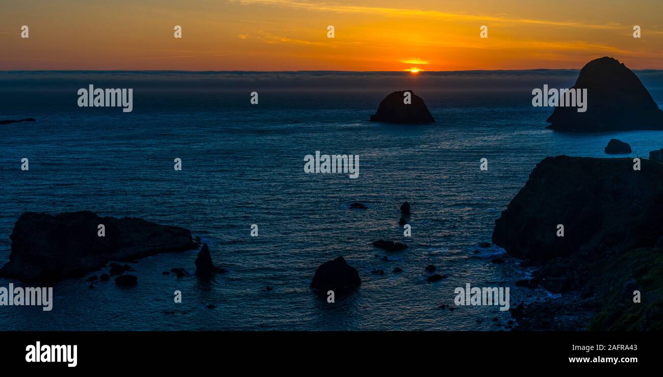 MAY 30, 2019, OREGON COASTLINE, USA - Sunset of sea stacks of rocks ...