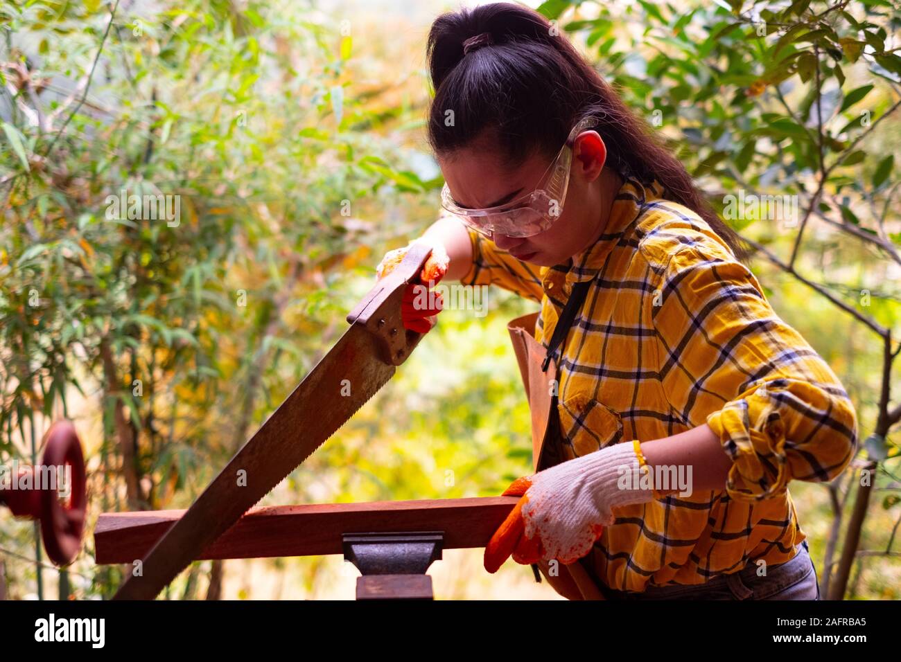 Cutting timber woman hi-res stock photography and images - Alamy