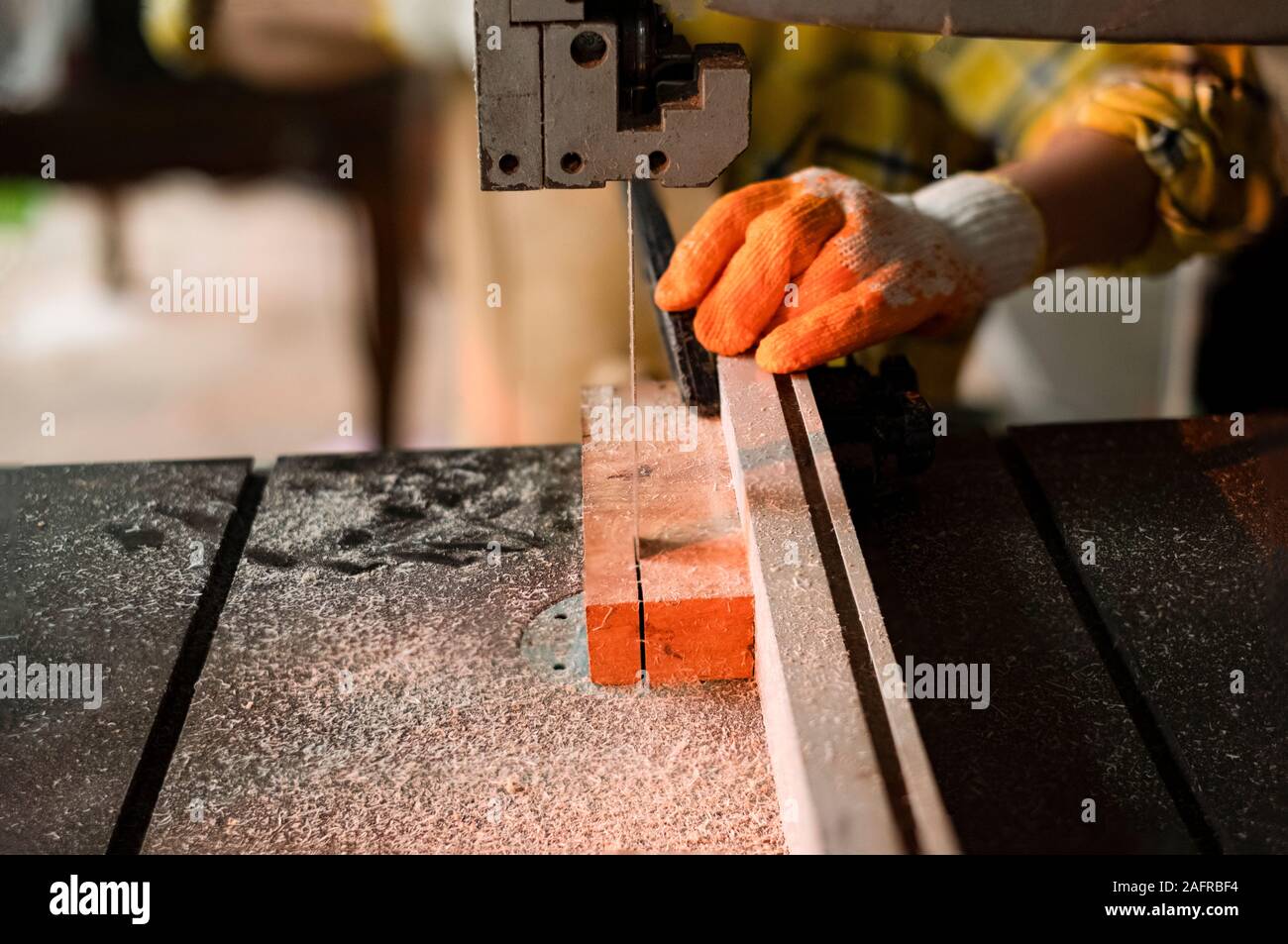 Woman sawed wood at the table in the workshop Stock Photo - Alamy