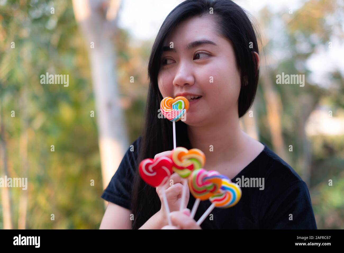 Hand full of sweets hi-res stock photography and images - Alamy