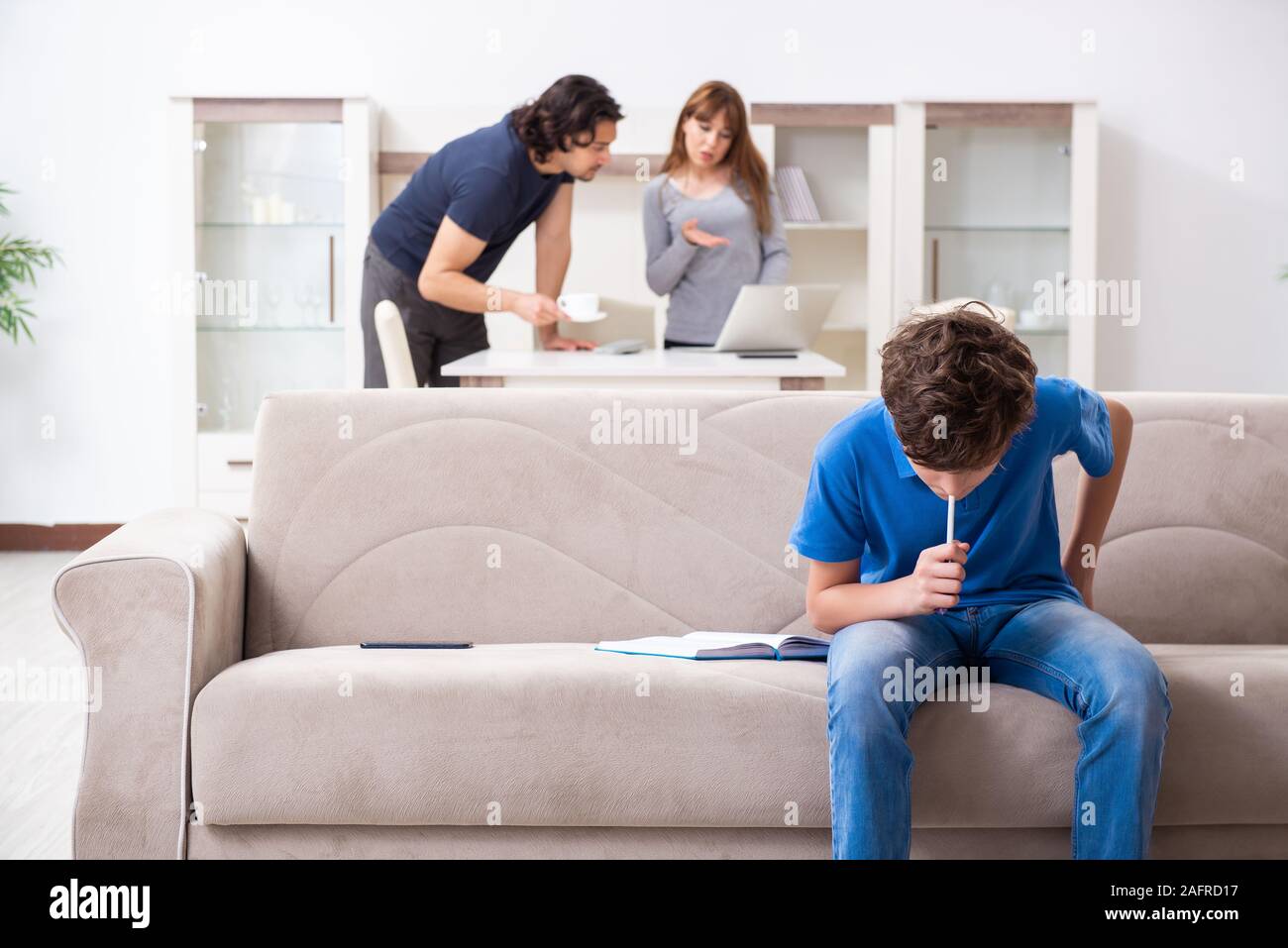 The concept of underage smoking with young boy and family Stock Photo ...