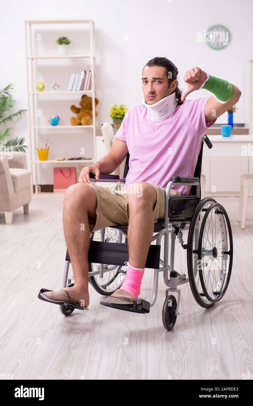 The young man suffering at home after car accident Stock Photo - Alamy