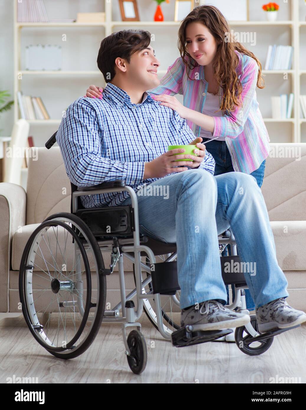Young family taking care of each other Stock Photo - Alamy