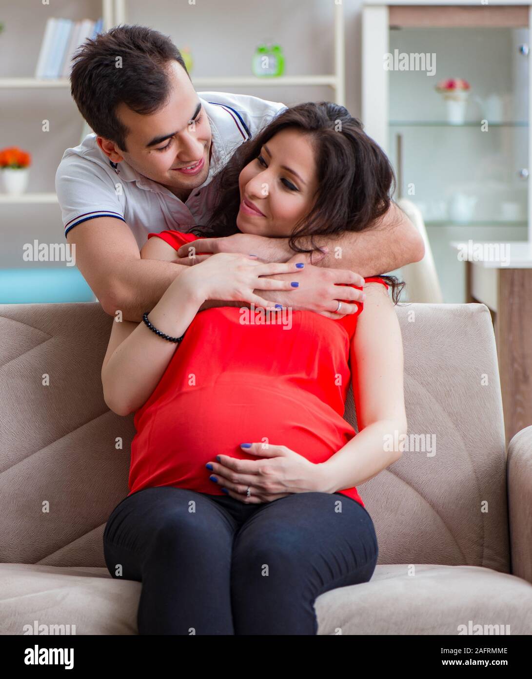 The young couple family expecting a baby Stock Photo - Alamy