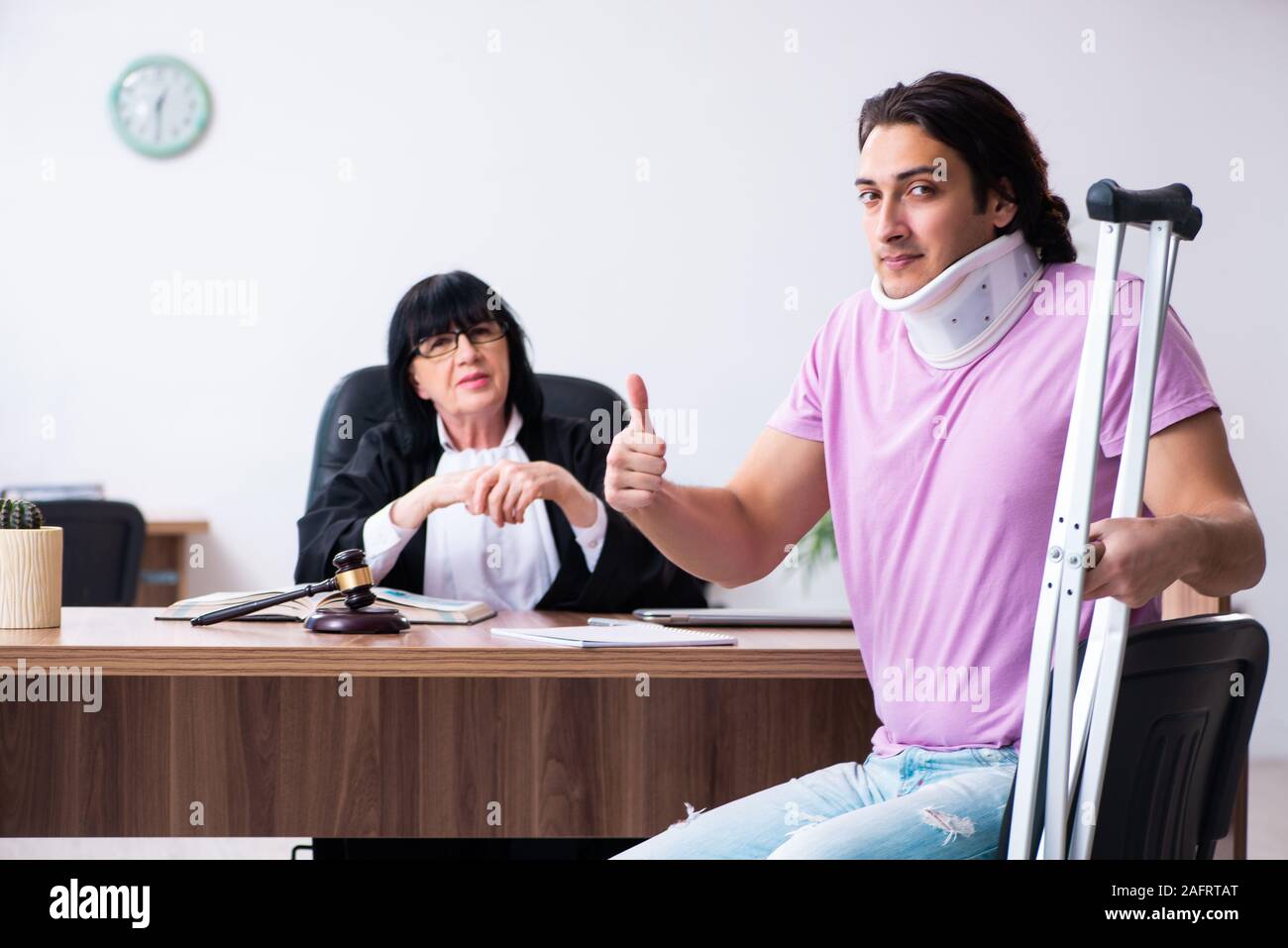 The disabled man consulting judge for damages litigation Stock Photo ...