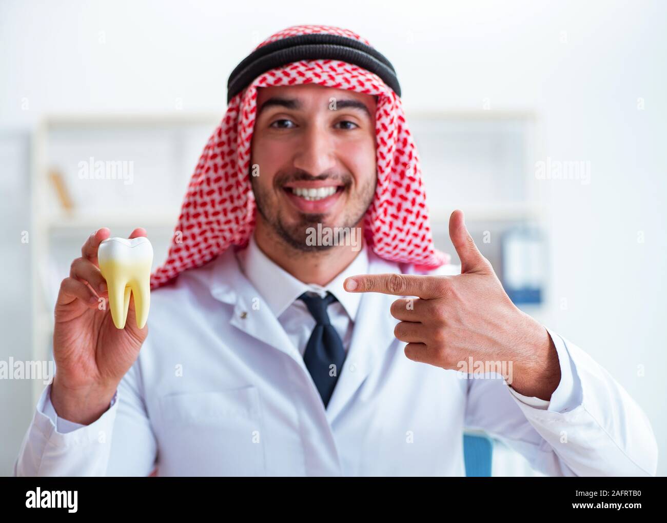 The arab dentist working on new teeth implant Stock Photo - Alamy