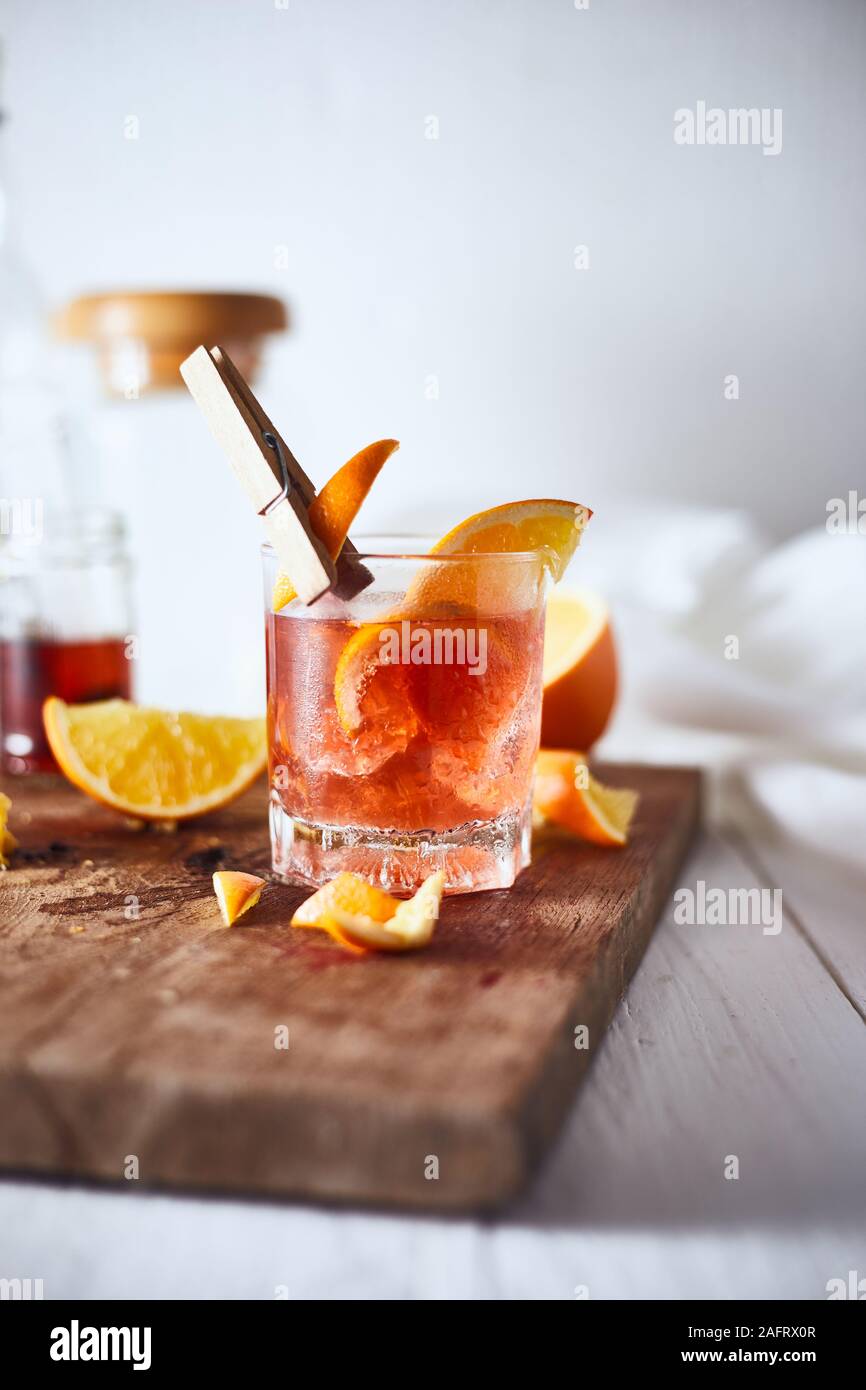 Alcoholic cocktail with orange peel and ice Stock Photo - Alamy