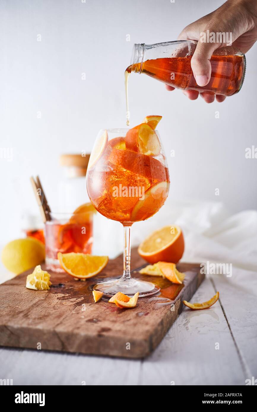 Alcoholic cocktail with orange peel and ice Stock Photo - Alamy