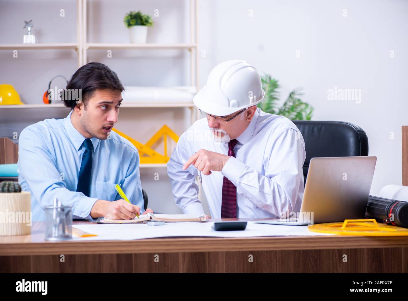 The two architects working on the project Stock Photo - Alamy
