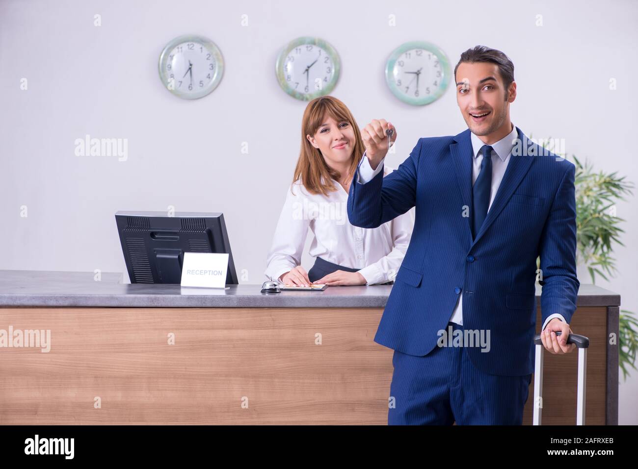 The young businessman at hotel reception Stock Photo - Alamy