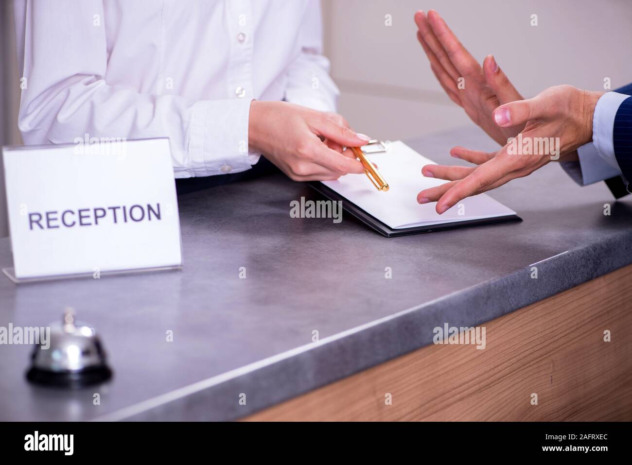 The hotel reception bell at the counter Stock Photo - Alamy