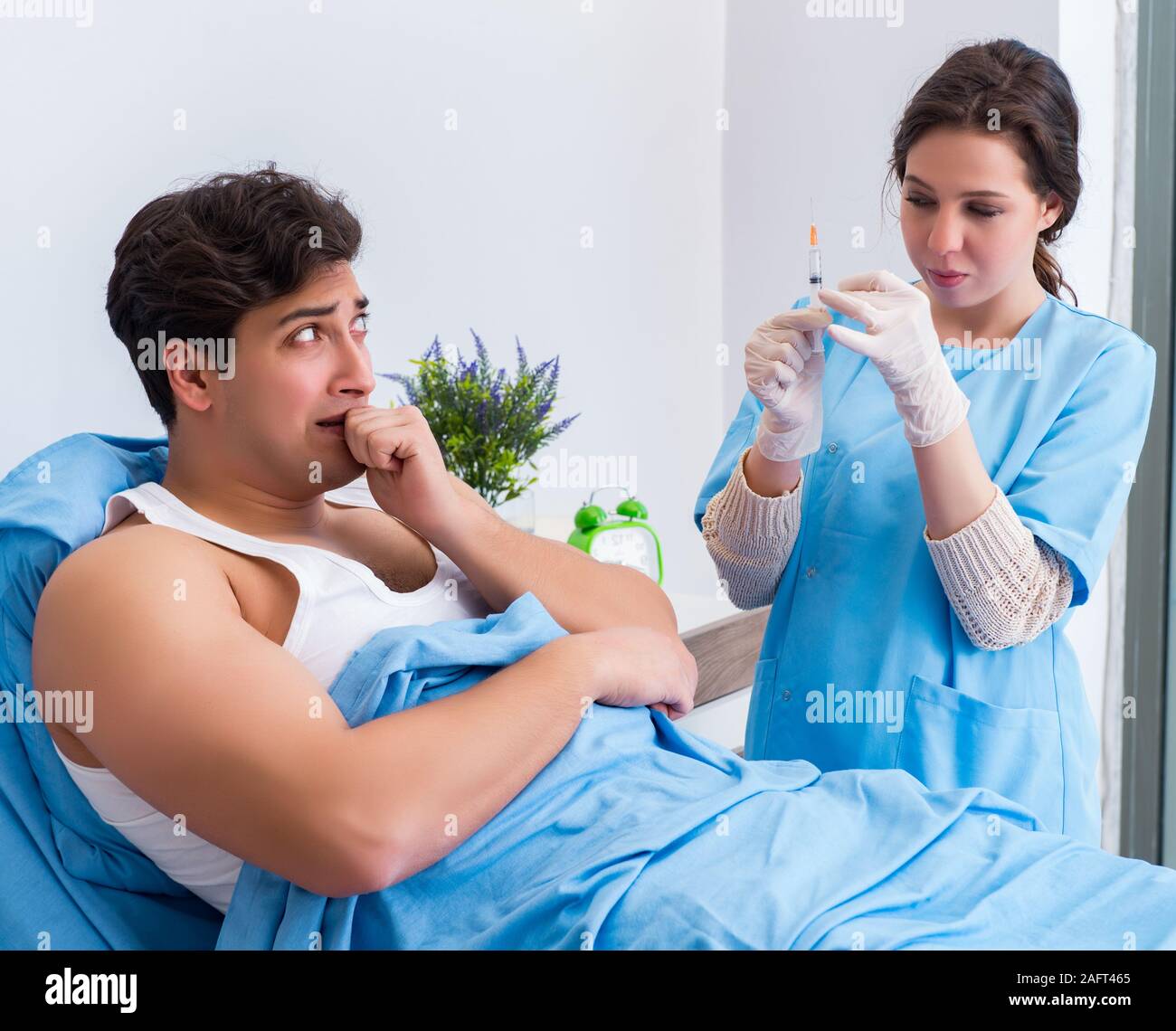 The doctor doing medical injection in hospital room Stock Photo - Alamy