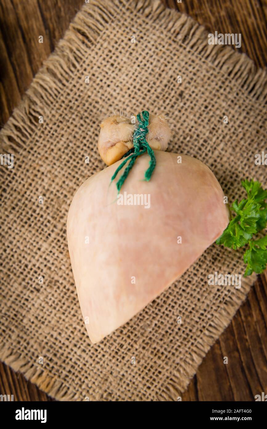 German Leberwurst on an old wooden table as detailed close-up shot ...