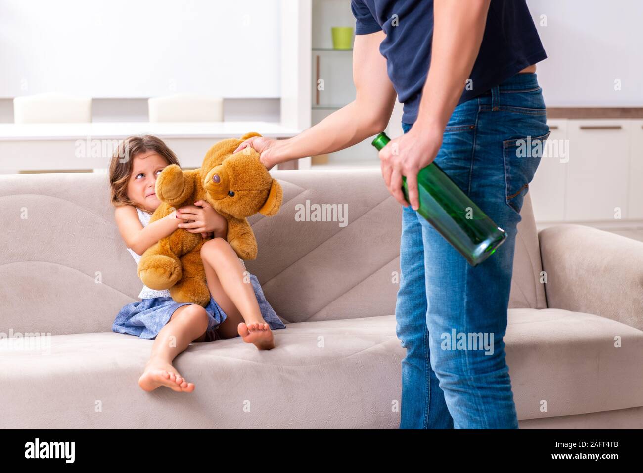 The drunk father in domestic child abuse and violence concept Stock ...