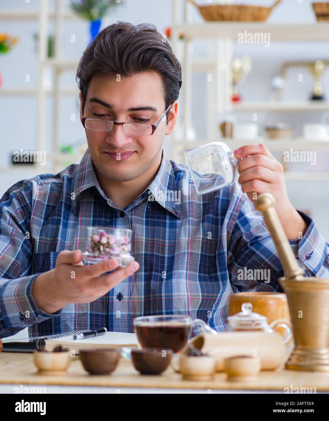 Tea expert brewing cup of drink hi-res stock photography and images - Alamy