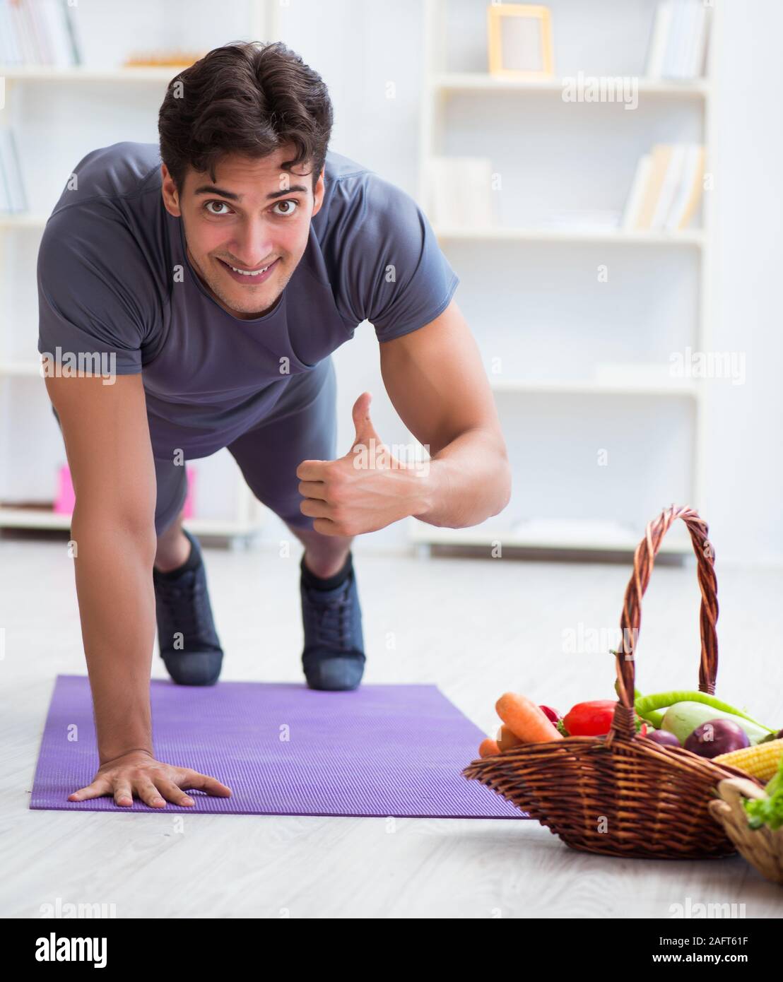 The man promoting the benefits of healthy eating and doing sports Stock ...