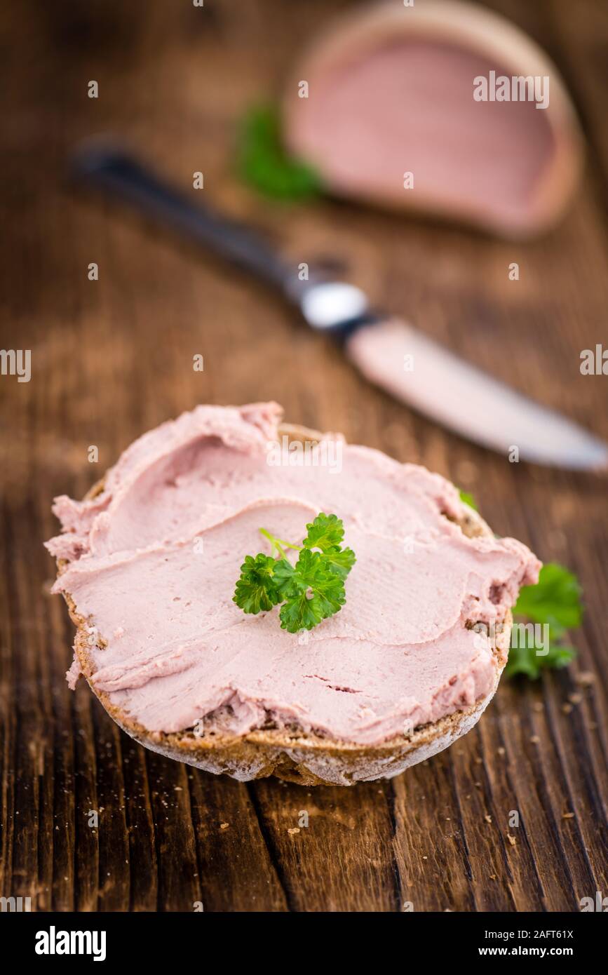 Homemade Liverwurst Sandwich on an wooden table (selective focus) as ...