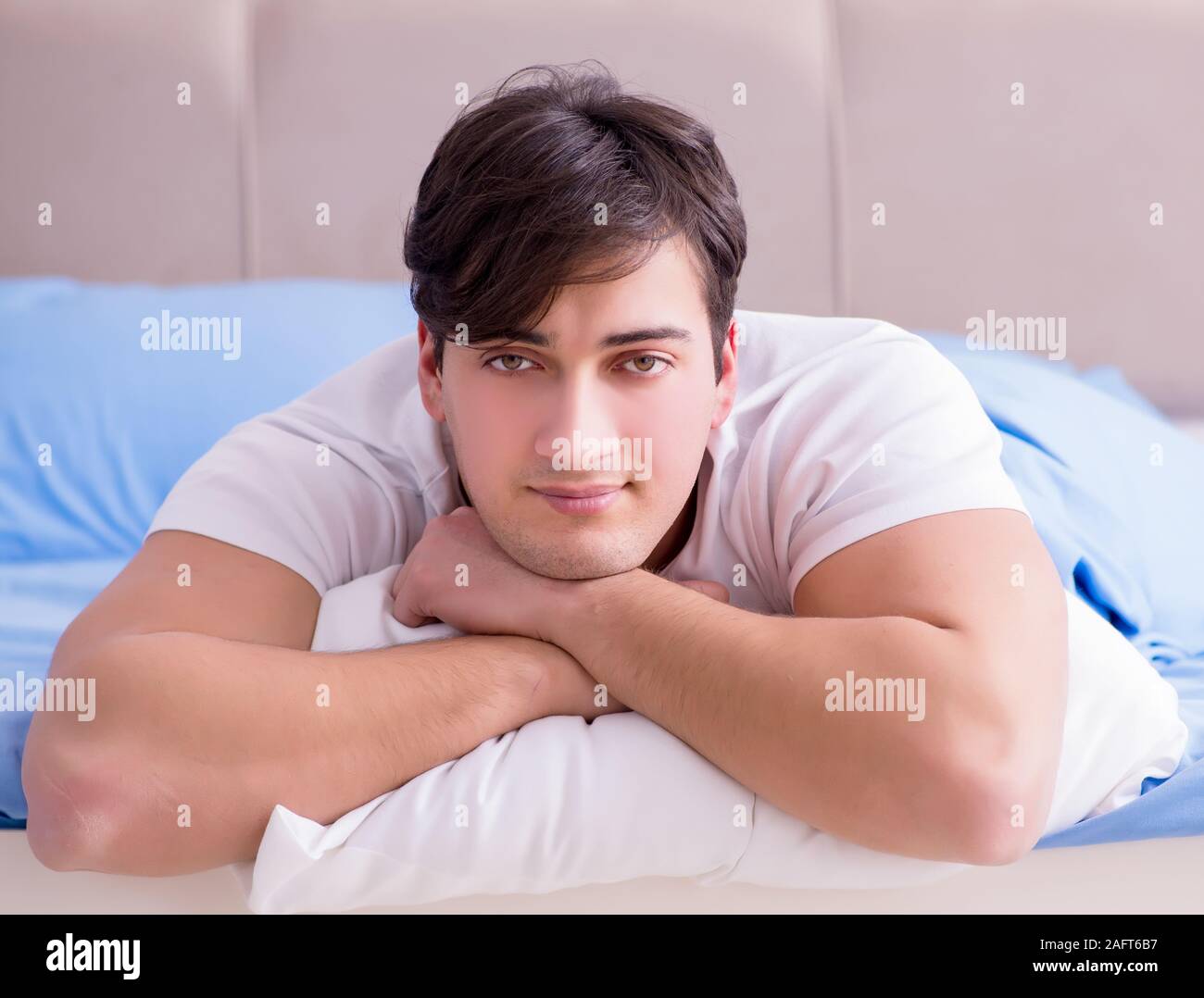 The man suffering from insomnia lying in bed Stock Photo - Alamy