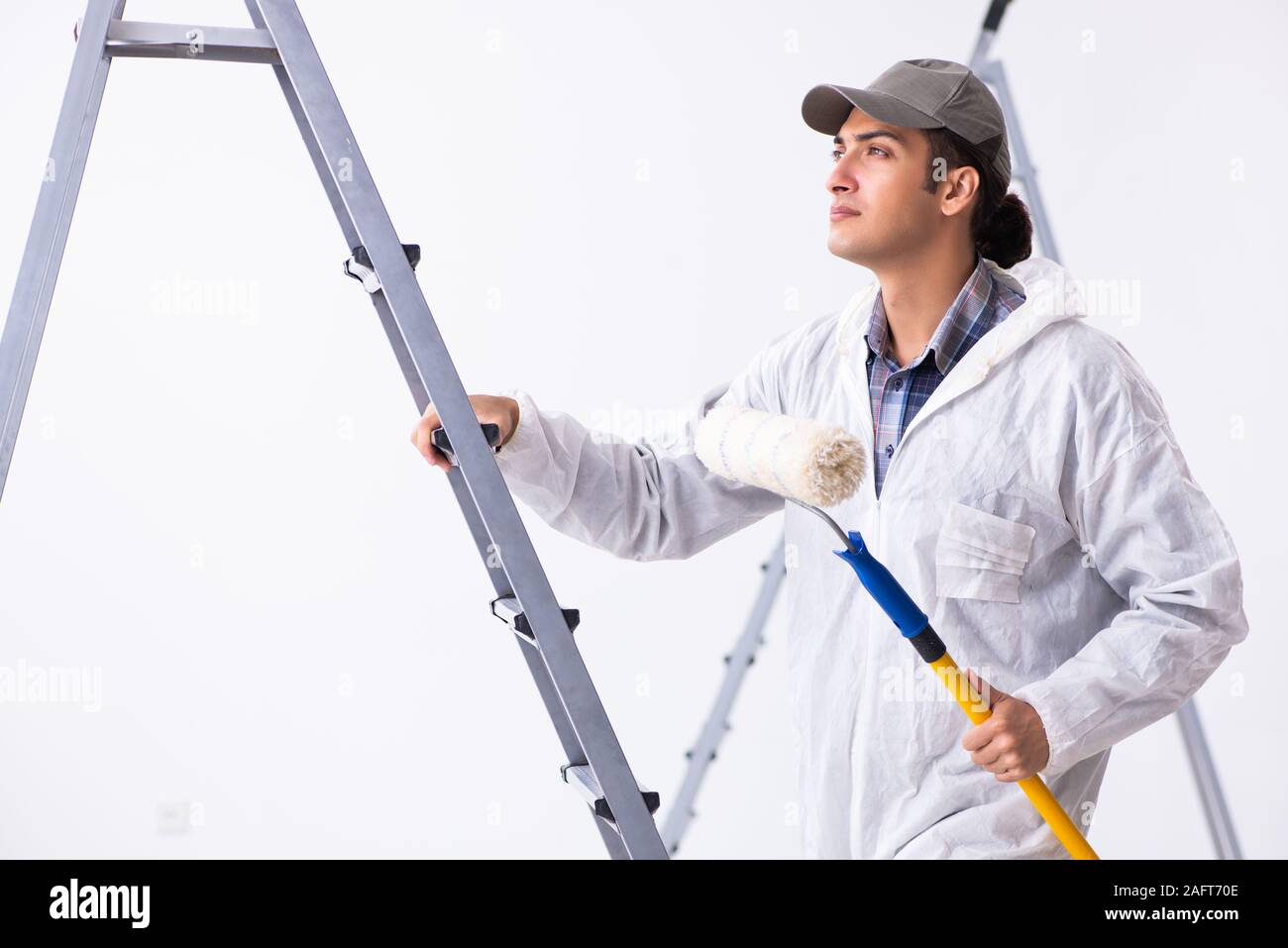 Painter working at the construction site Stock Photo - Alamy