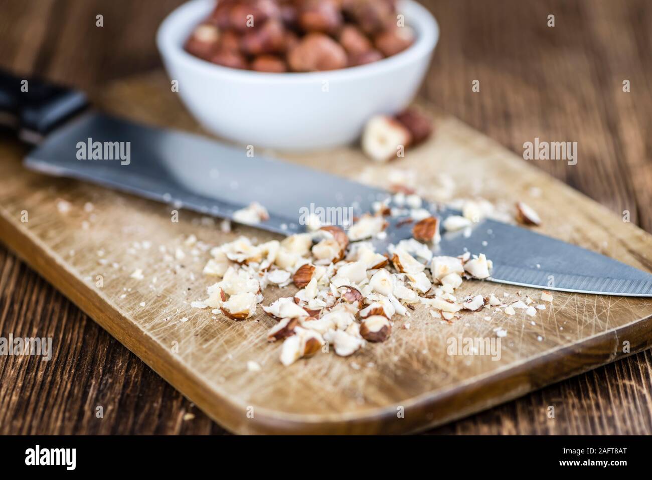 Chopped Hazelnuts (selective focus) on vintage background (close-up ...