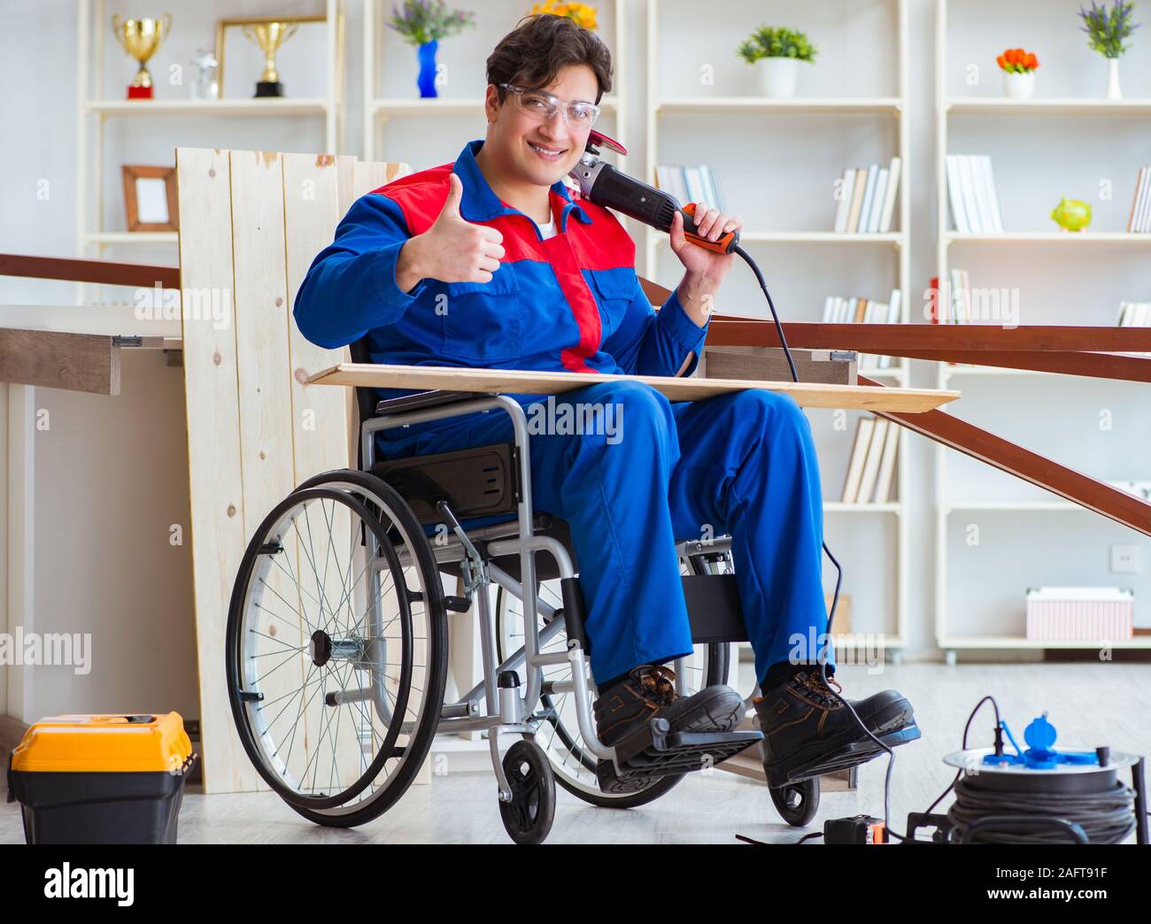 The disabled carpenter working with tools in workshop Stock Photo - Alamy
