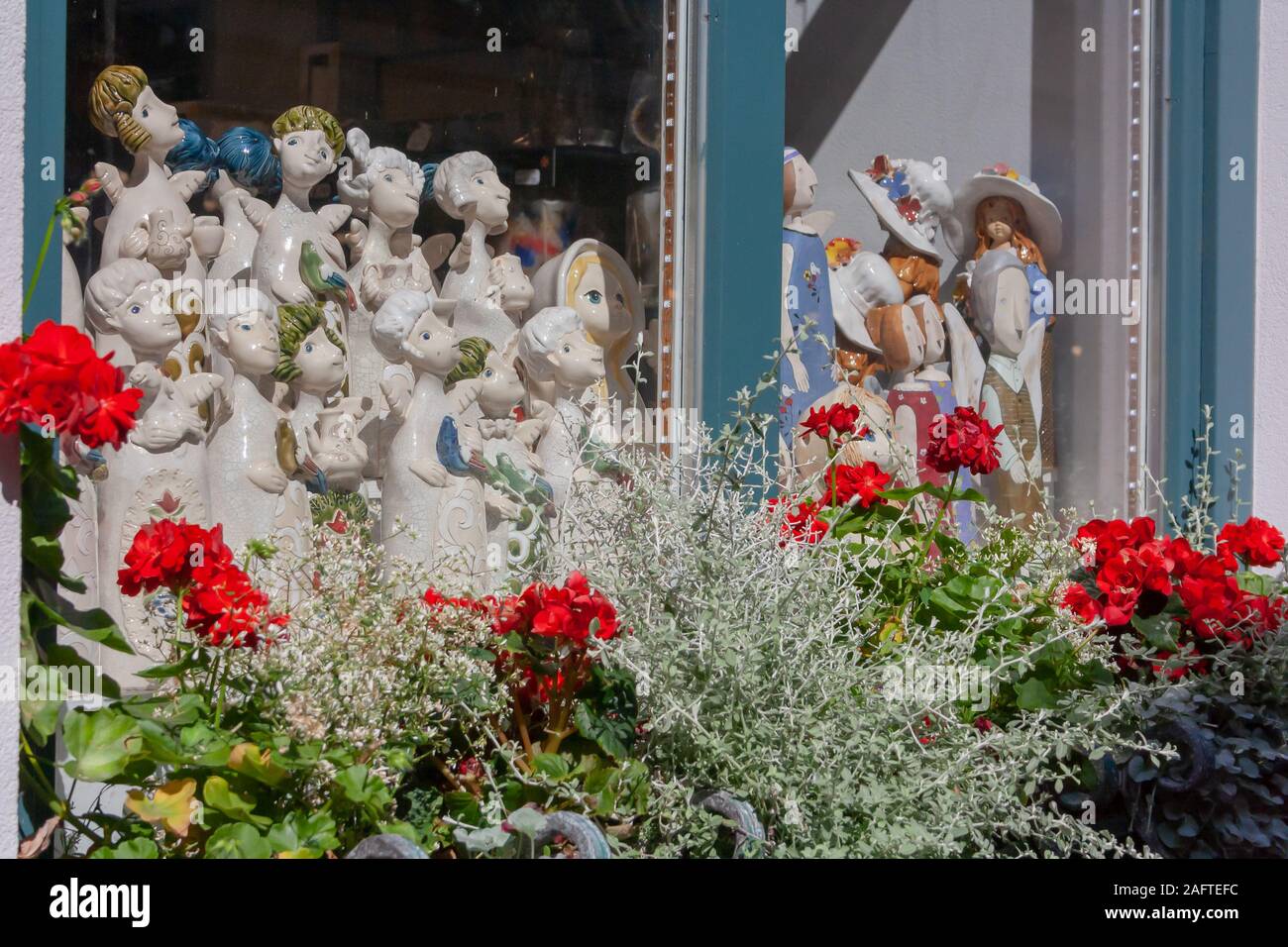 window decoration with porcelain angels and flowering flower boxes ...