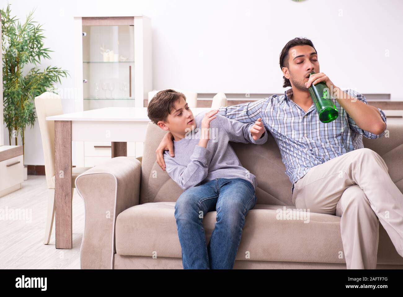 The drunk father and his son Stock Photo - Alamy
