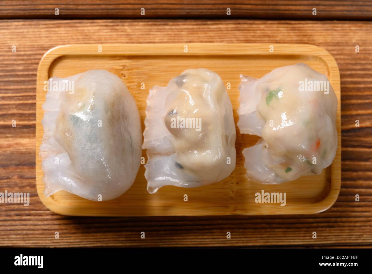 top view traditional Cantonese style dumplings on a wood table Stock ...