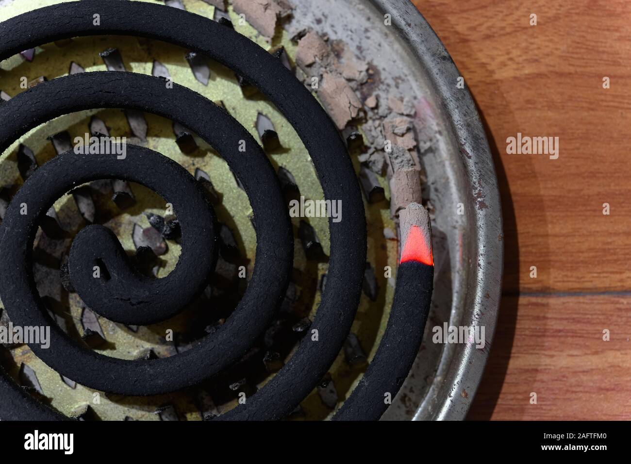 top view a burning mosquito coil Stock Photo - Alamy