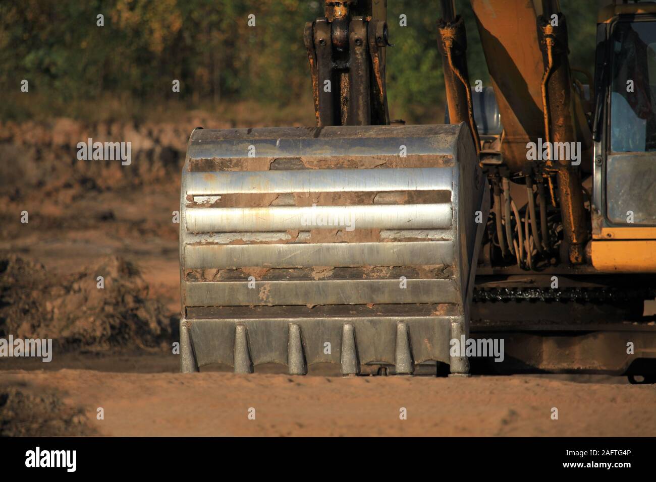 Excavator (digger) with a huge bucket at a construction site ...