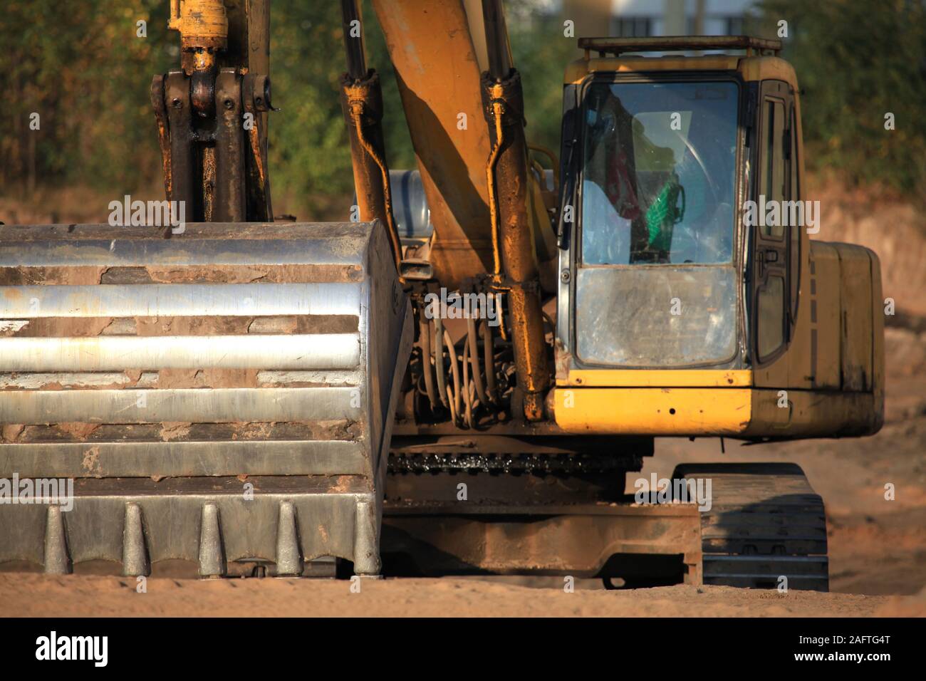 Excavator (digger) with a huge bucket at a construction site ...