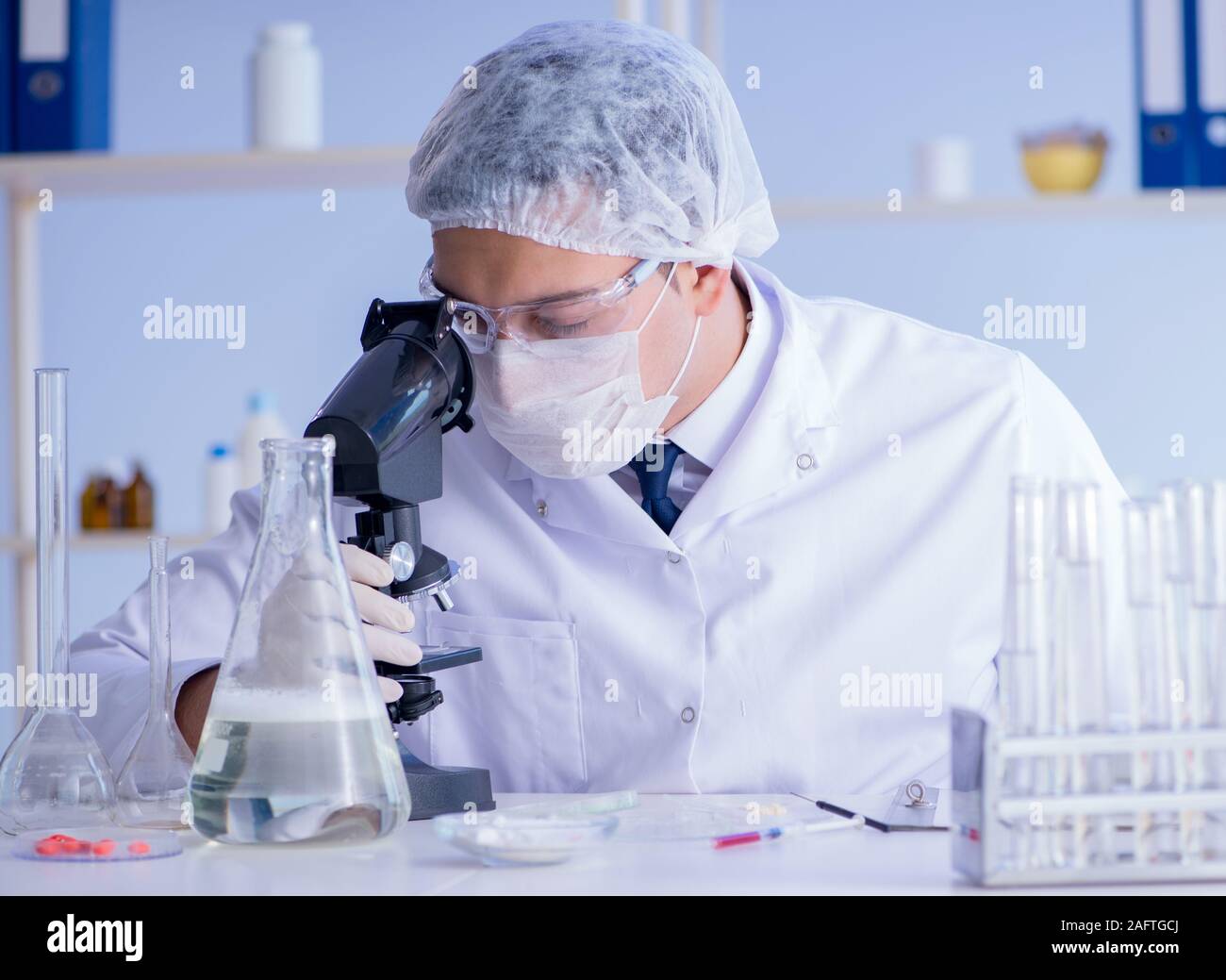 The man in the lab testing new cleaning solution detergent Stock Photo ...
