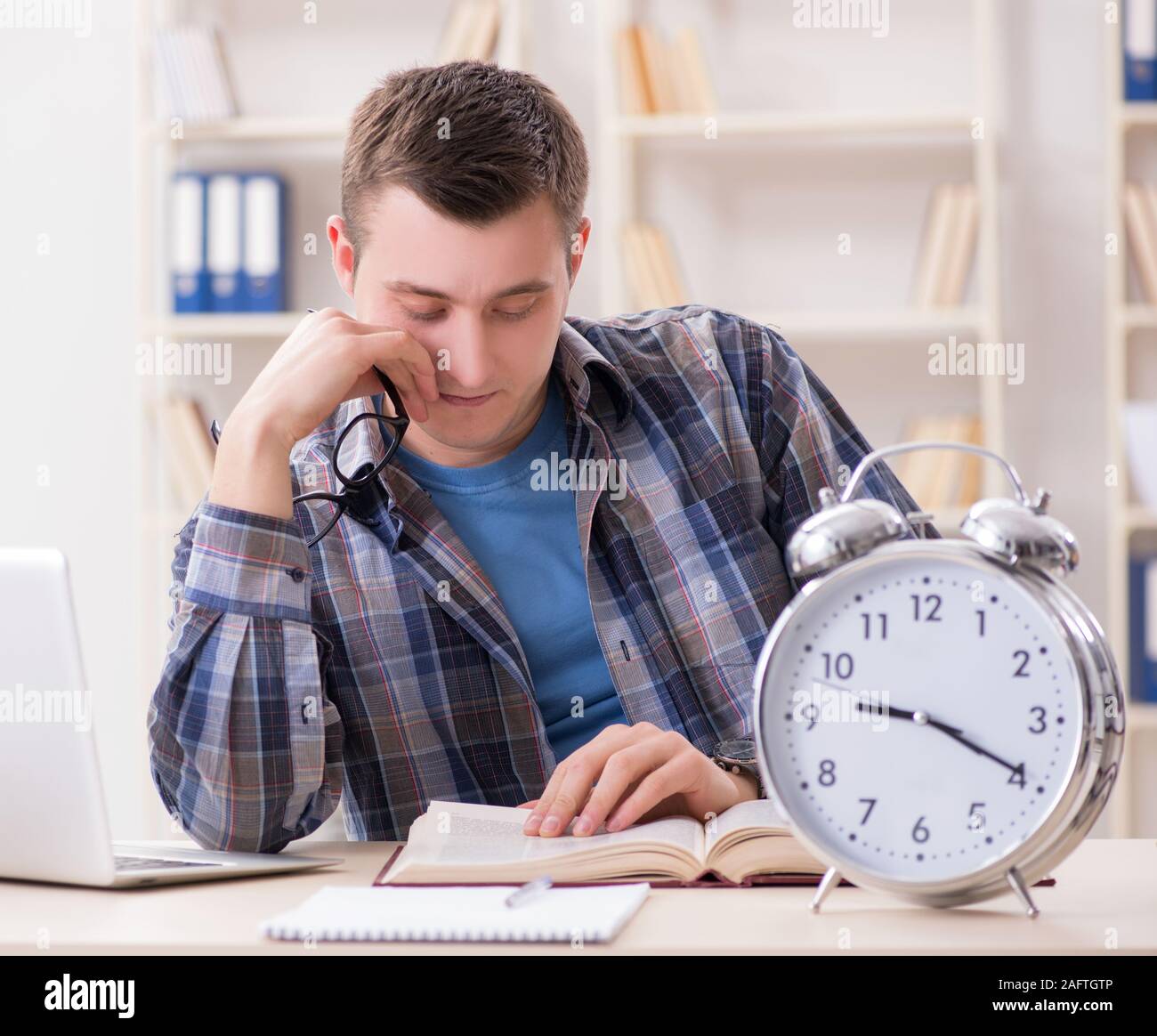 The student getting late with exam preparation Stock Photo - Alamy