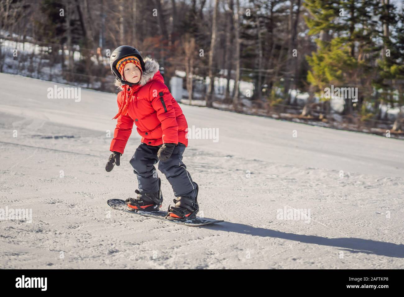 Child snowboard trick hi-res stock photography and images - Alamy