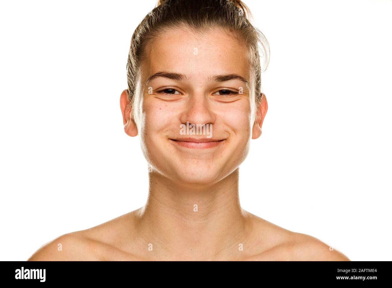 Portrait of young smiling woman without makeup on white background ...