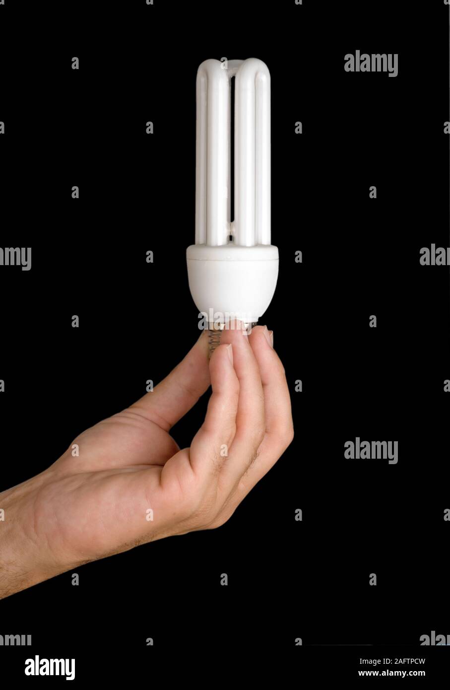 hand holding an energy-saving lamp Stock Photo - Alamy