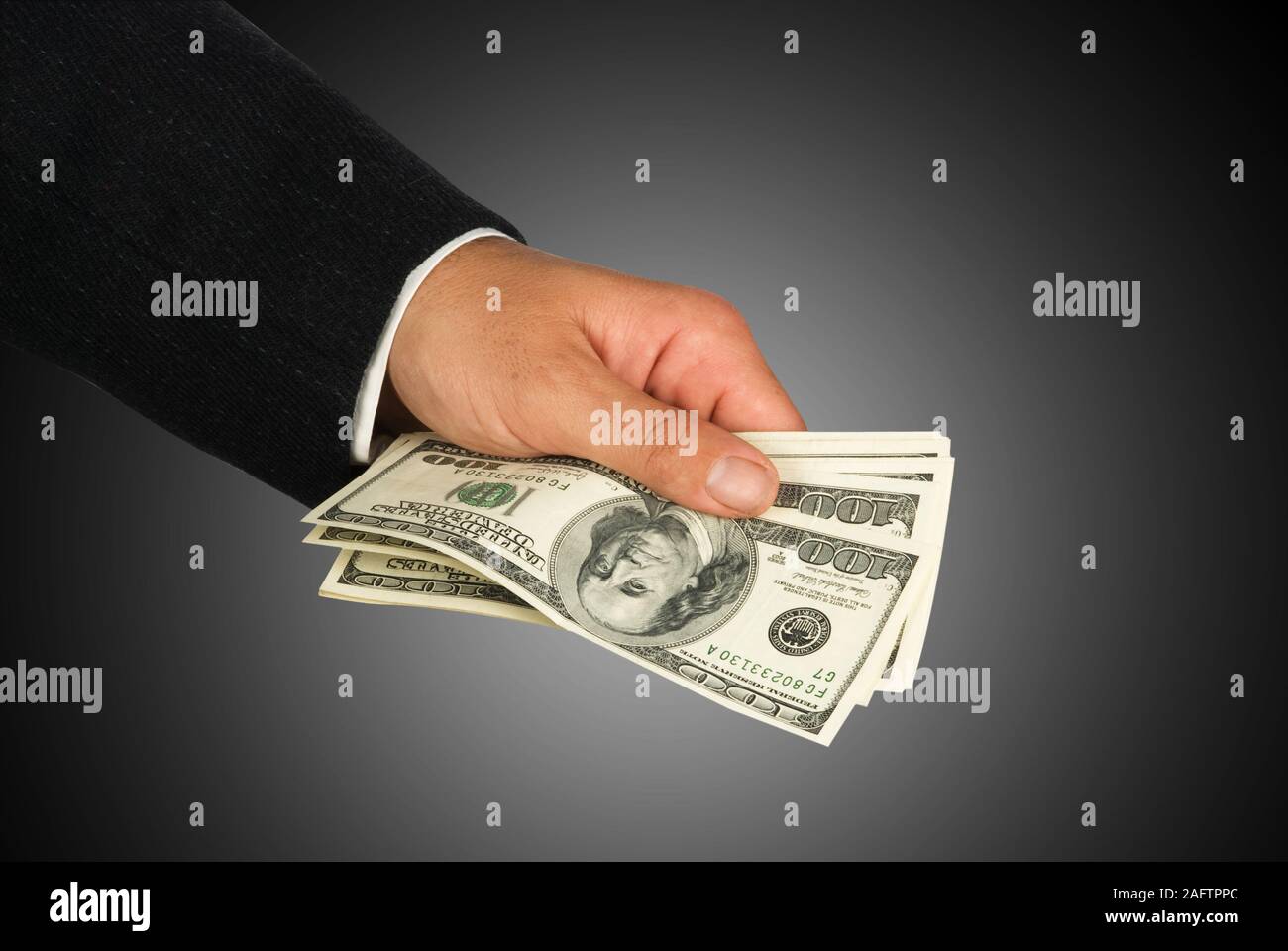 Hand with dollar bills Stock Photo - Alamy