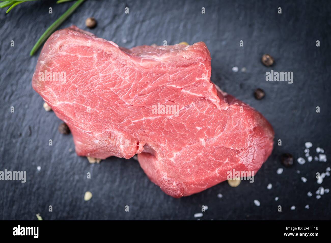 Slate slab with raw Beef Fillet Stock Photo - Alamy