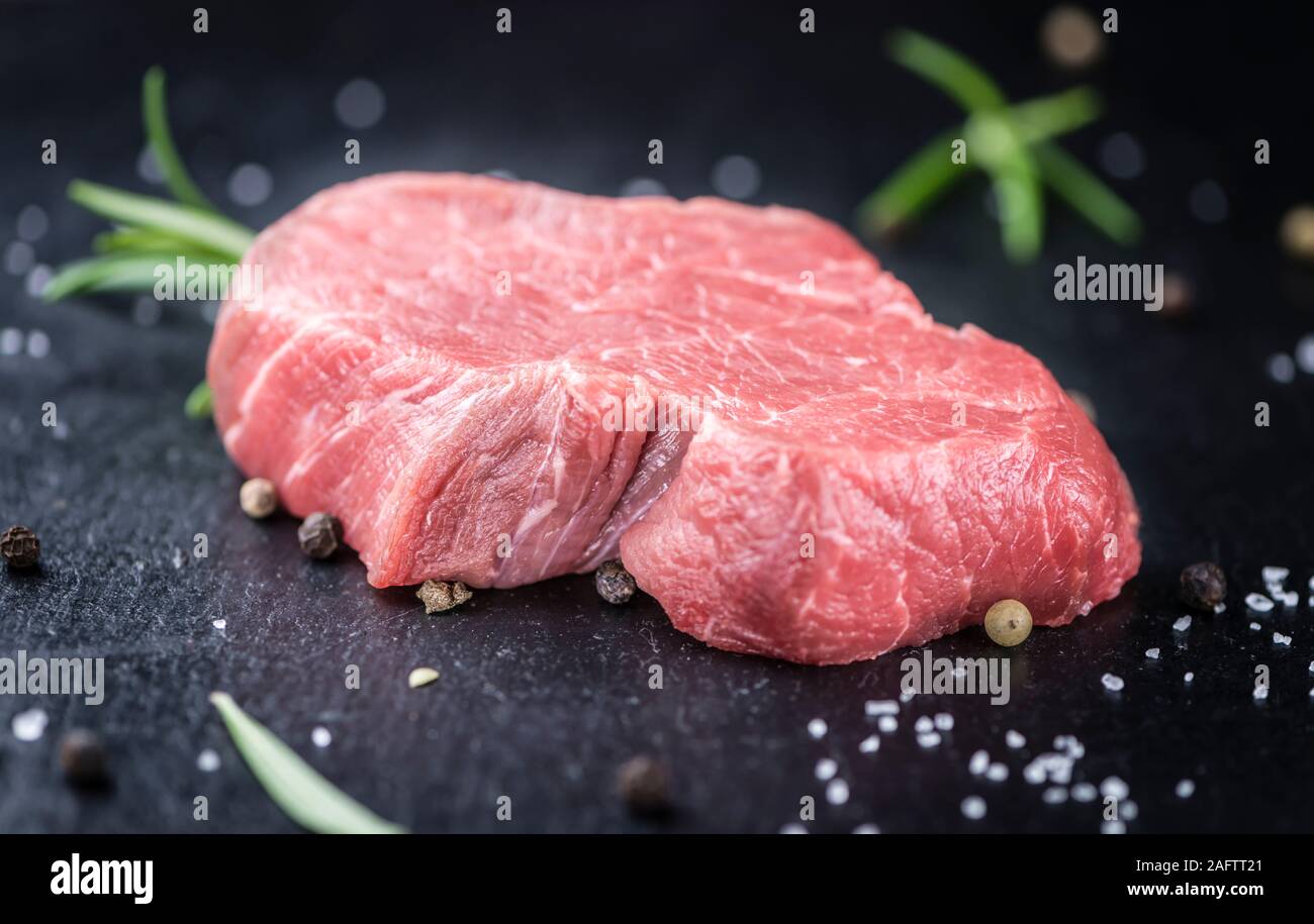Piece of raw Beef Fillet on a slate slab (selective focus; close-up shot Stock Photo - Alamy