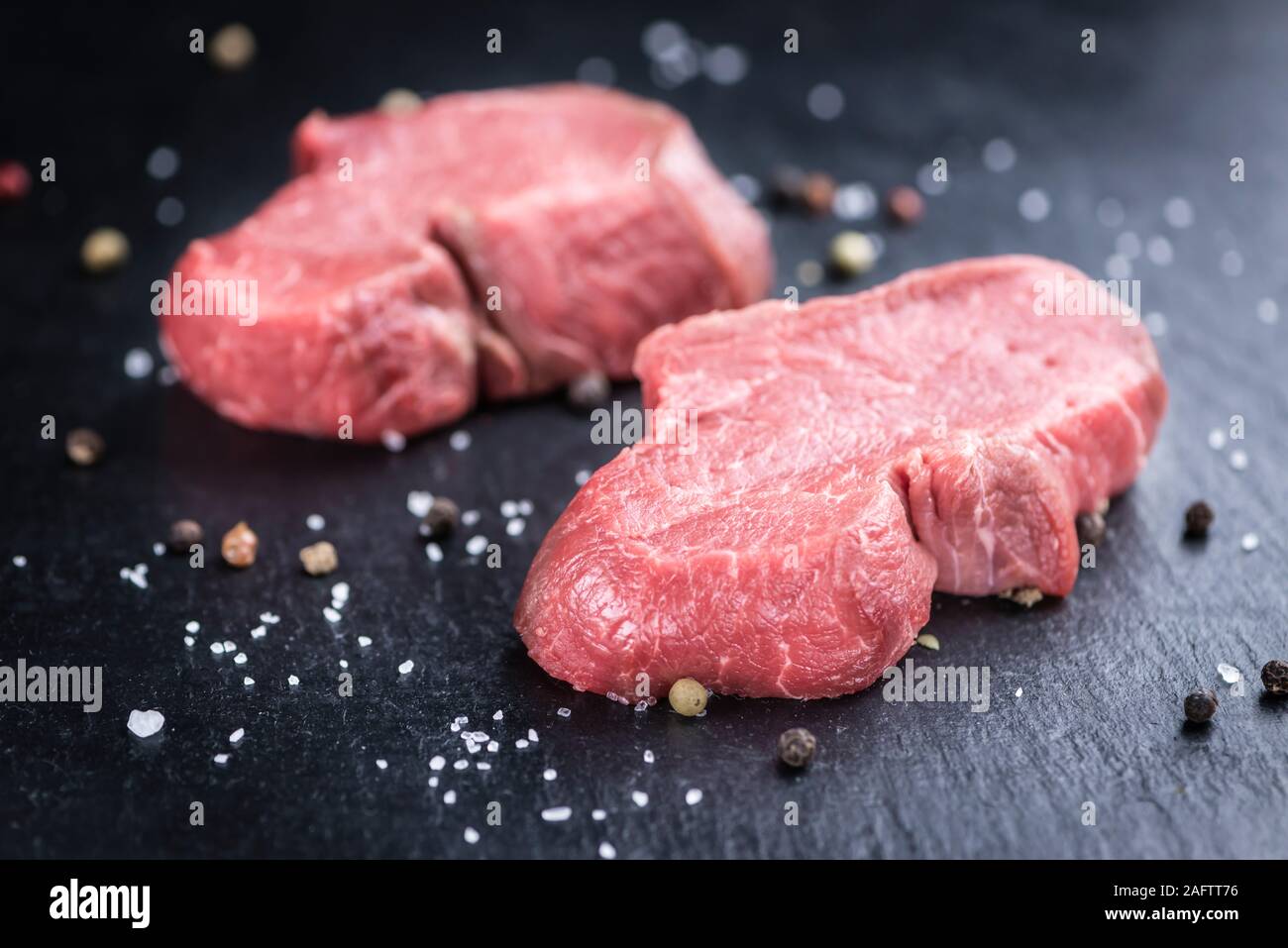 Slate slab with raw Beef Fillet Stock Photo - Alamy