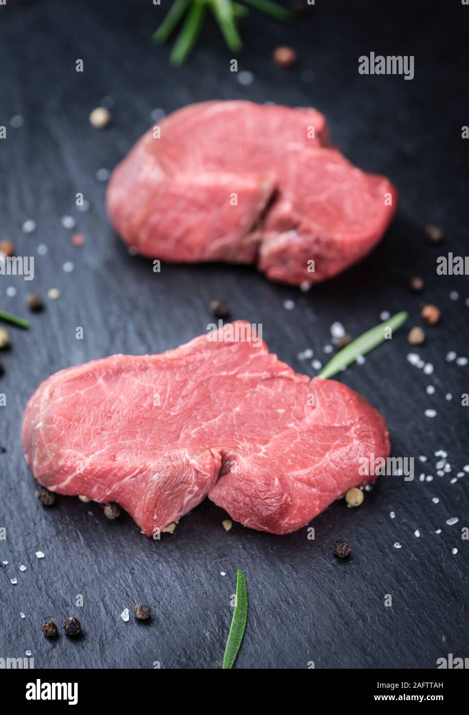Slate slab with raw Beef Fillet Stock Photo - Alamy