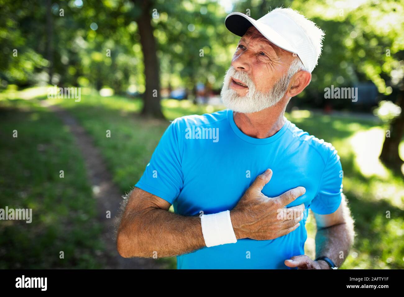 Older man heart attack after running workout outdoor Stock Photo - Alamy