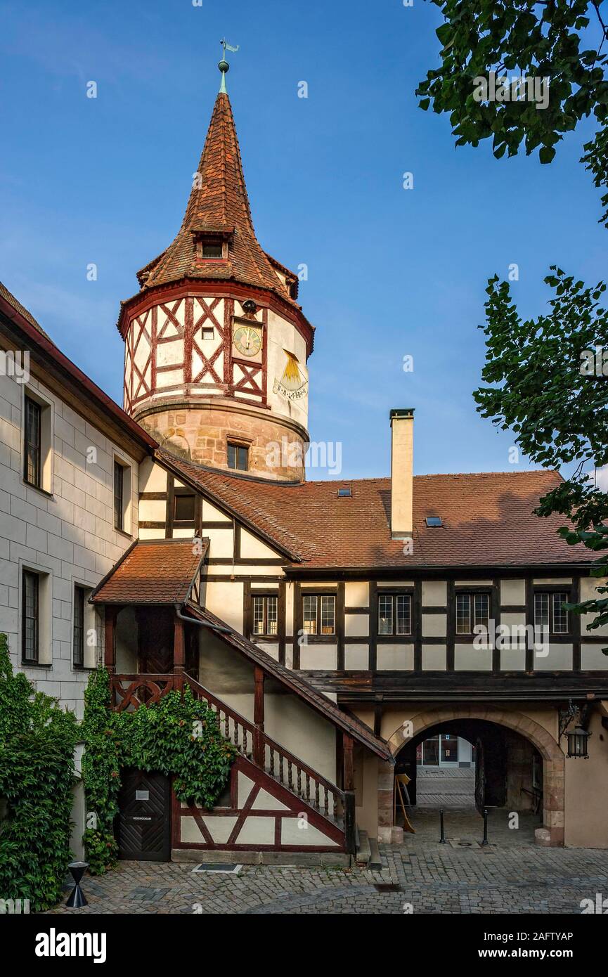 Gothic half-timbered tower and gate to the castle courtyard, hunting ...