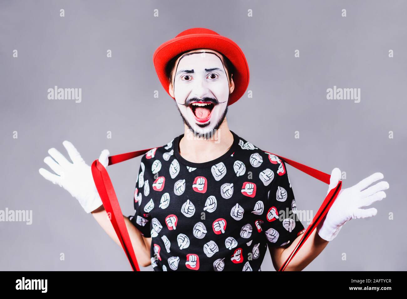 Mime poses and grimaces in the studio Stock Photo - Alamy