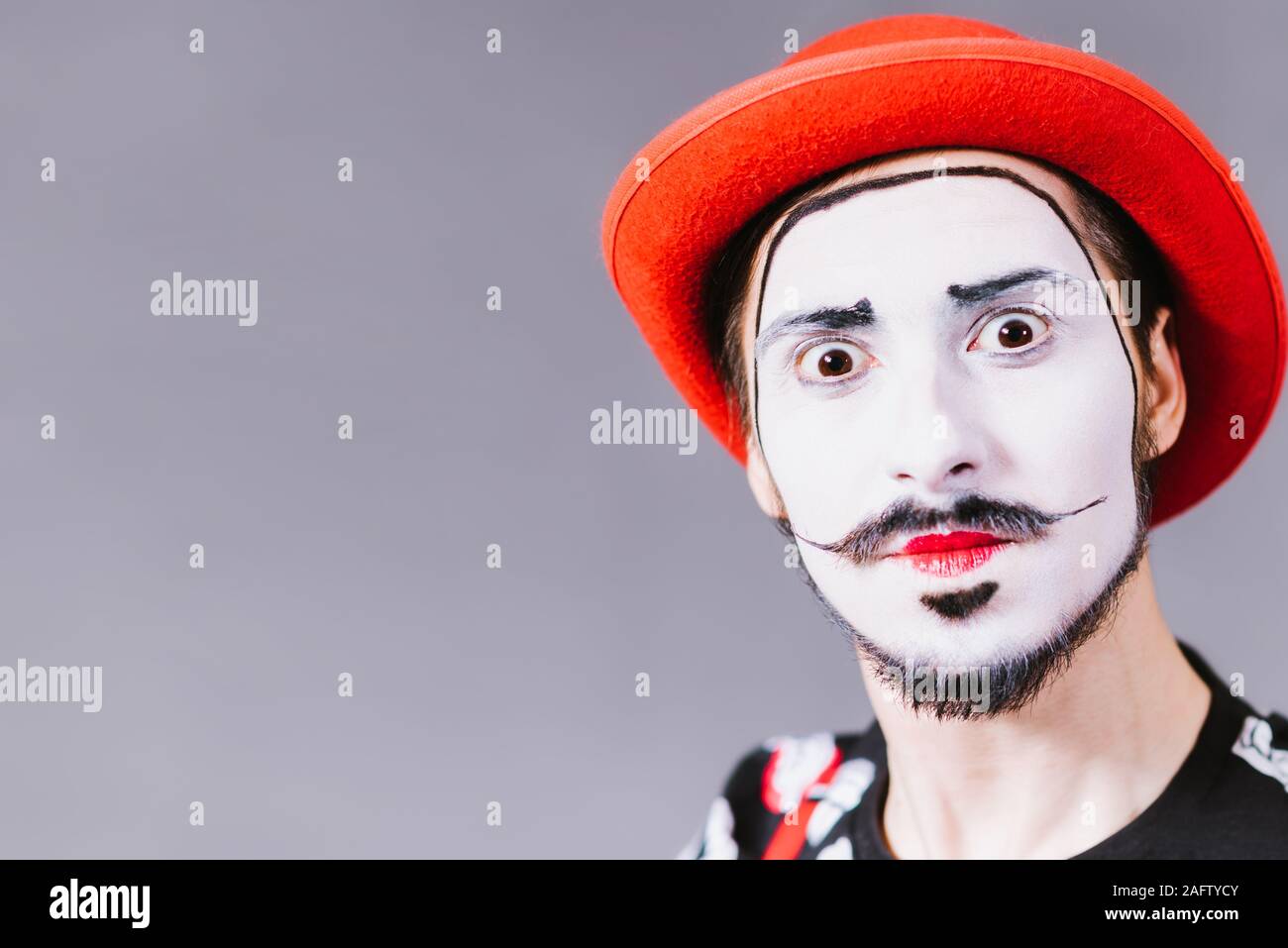 Mime poses and grimaces in the studio Stock Photo - Alamy