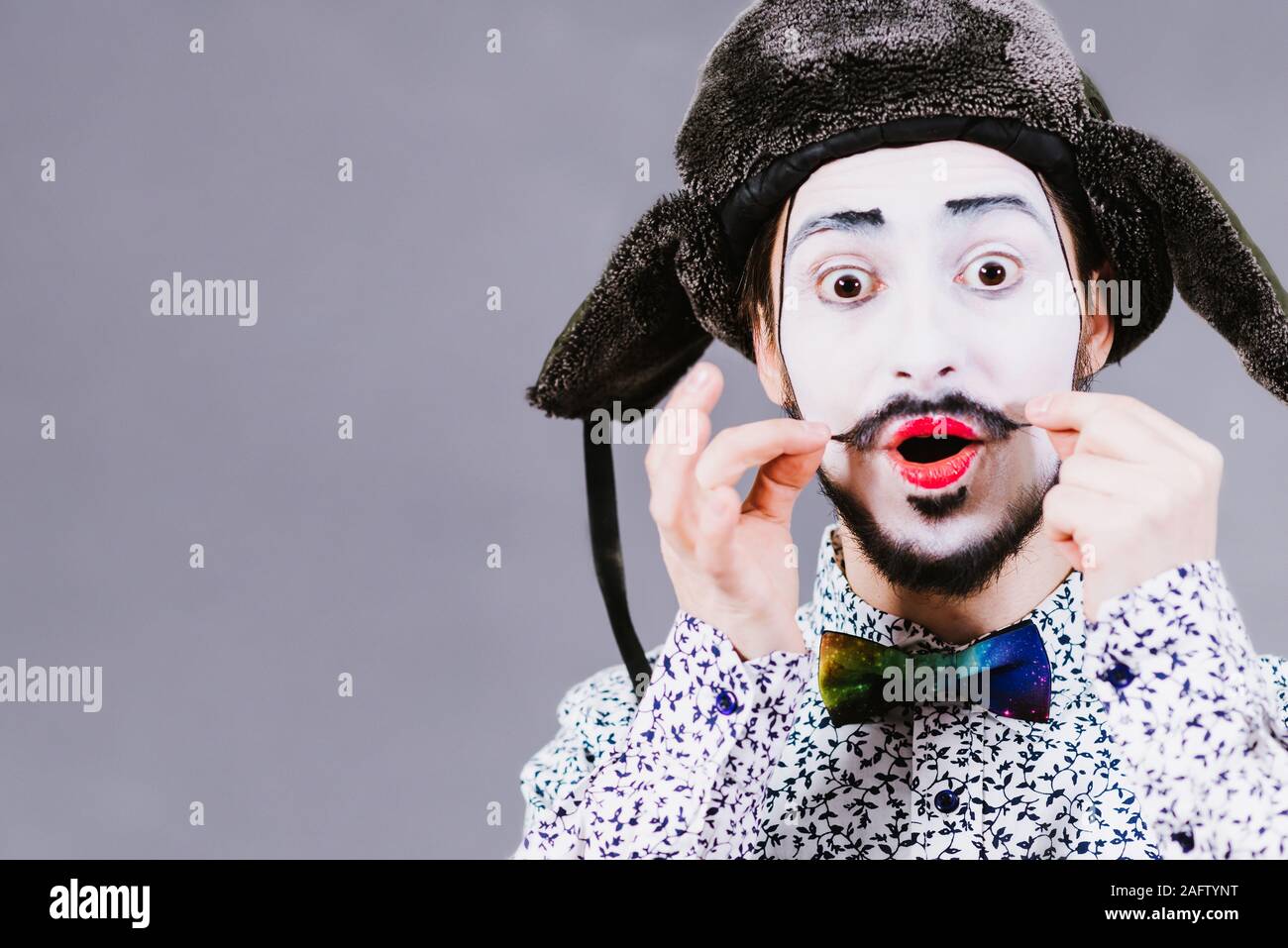 Mime poses and grimaces in the studio Stock Photo - Alamy